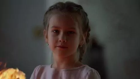 A young girl wielding fire power, and everything