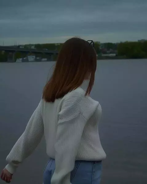 the girl turns her back and bends forward, wide