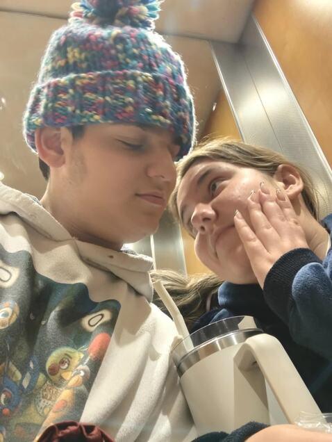 Make the two people french kiss deeply with tong